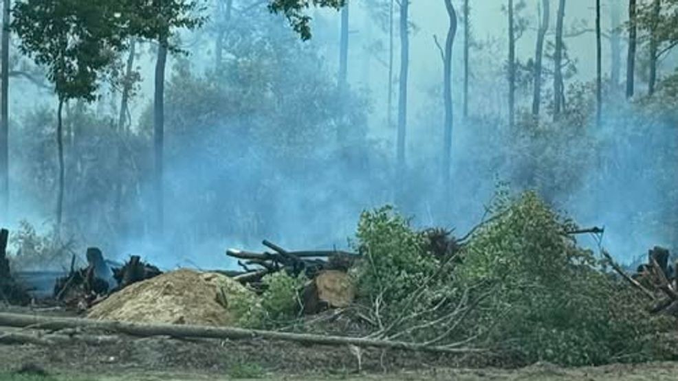 Crews battle 1-acre woods fire near Bombing Range Road