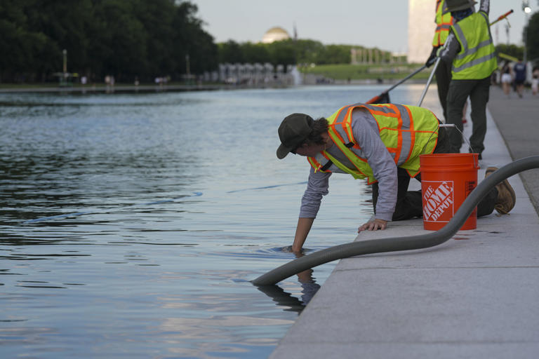 Rips appear in Reflecting Pool's new surface after algae turn water green
