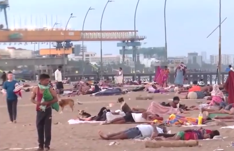 Mumbai residents sleep on Versova beach to escape extreme heat
