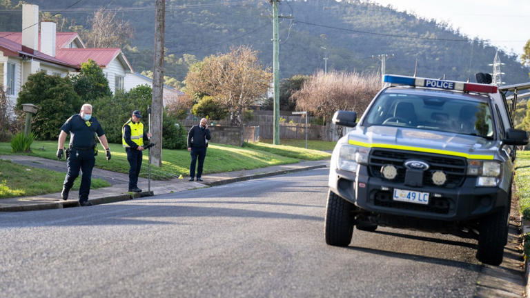 Woman struck man with car 'at speed' in Hobart frontyard, police say