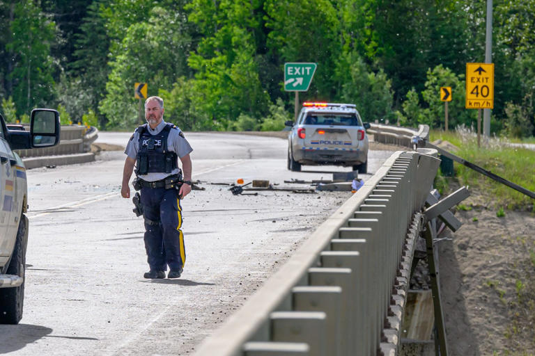 Driver missing after crane goes over bridge and into river in northern ...