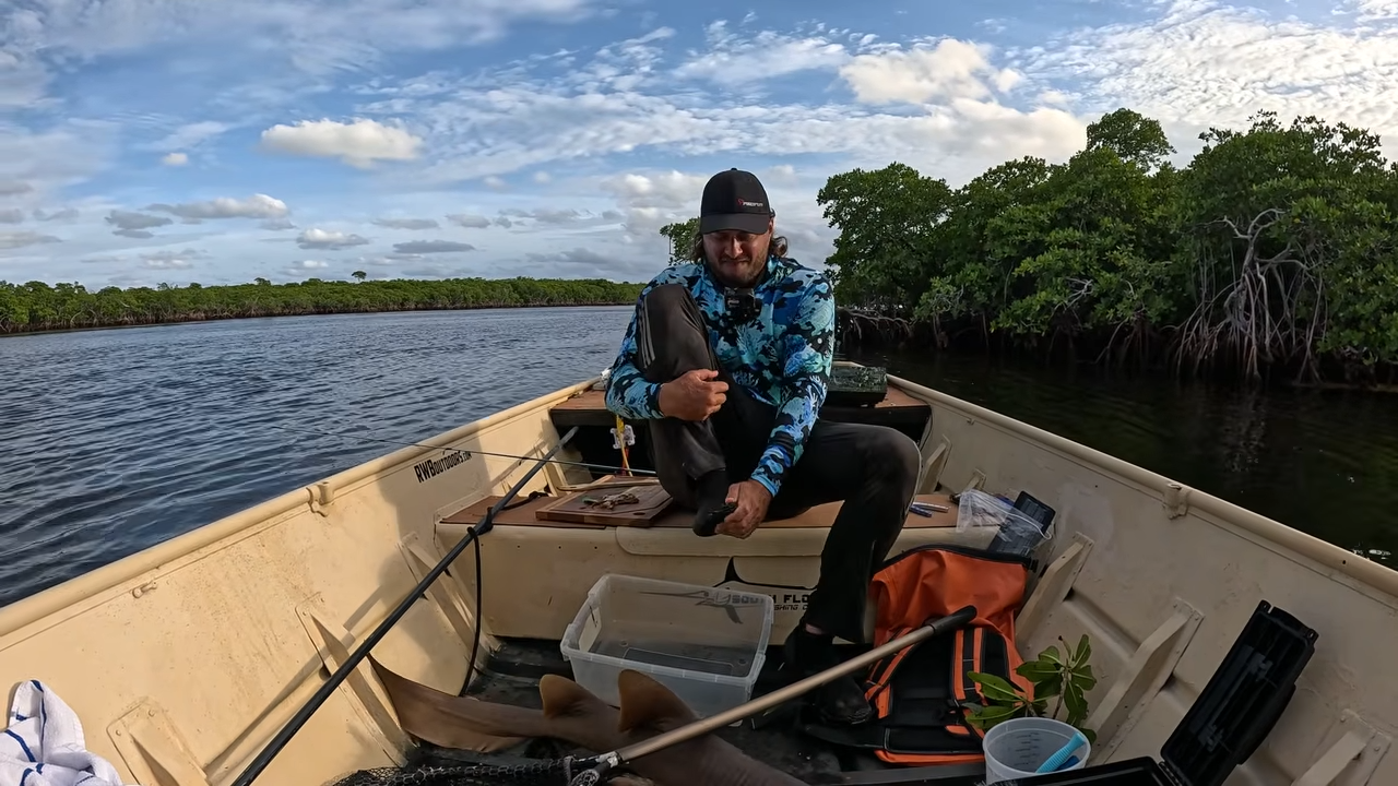 The shark was violently dragging him onto the boat, pulling with such ...