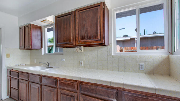 Forget paint and stain — a smarter way to update a kitchen with dated ...