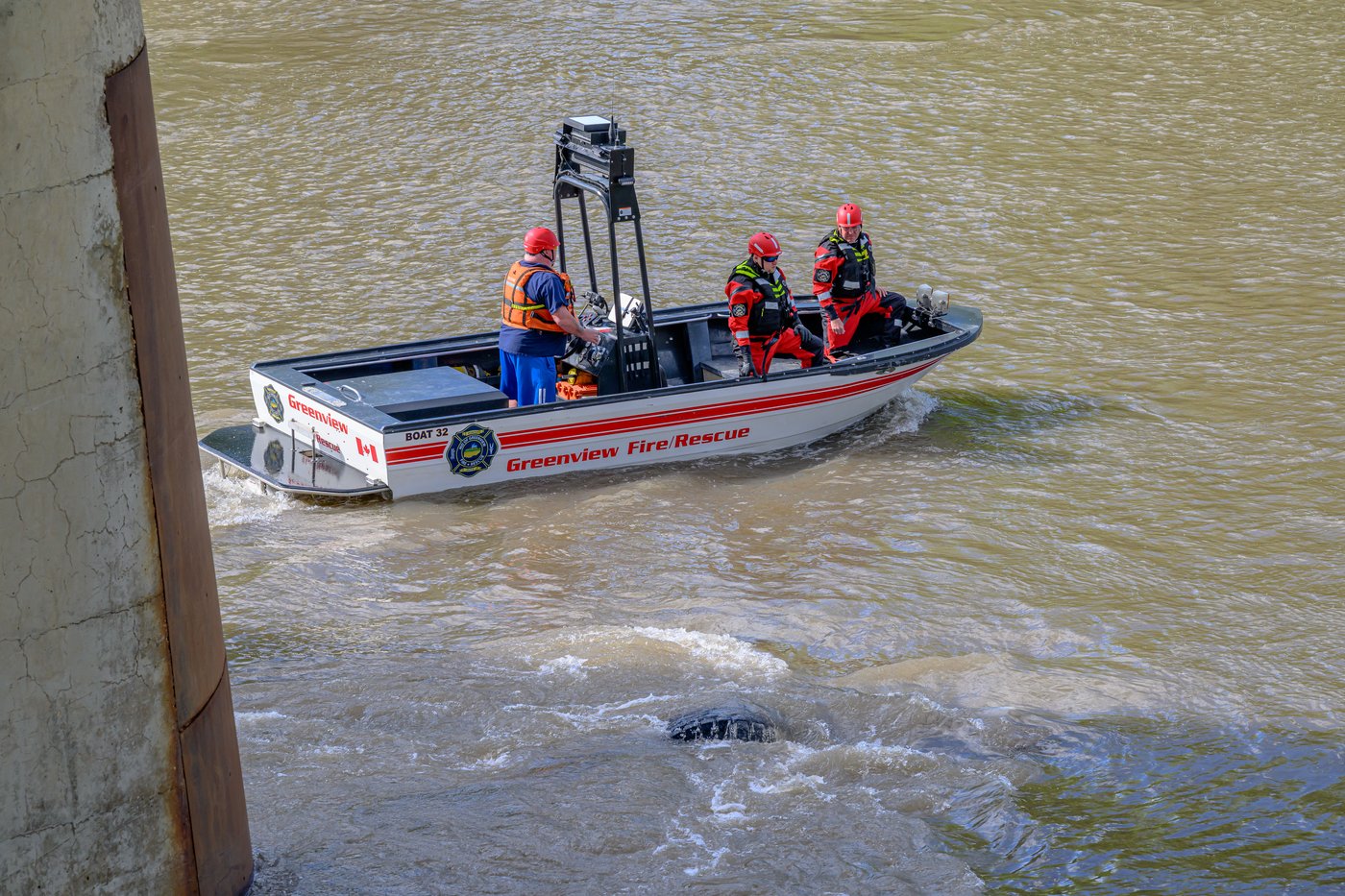 Driver missing after crane goes over bridge and into river in northern ...