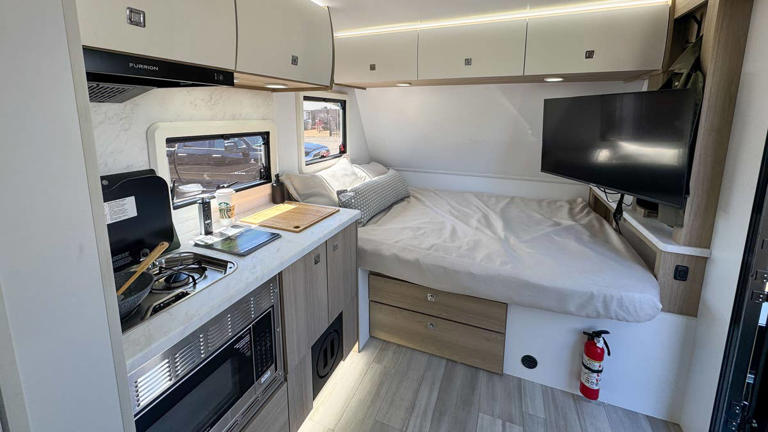 This compact off-road camper has two kitchens and a full bathroom