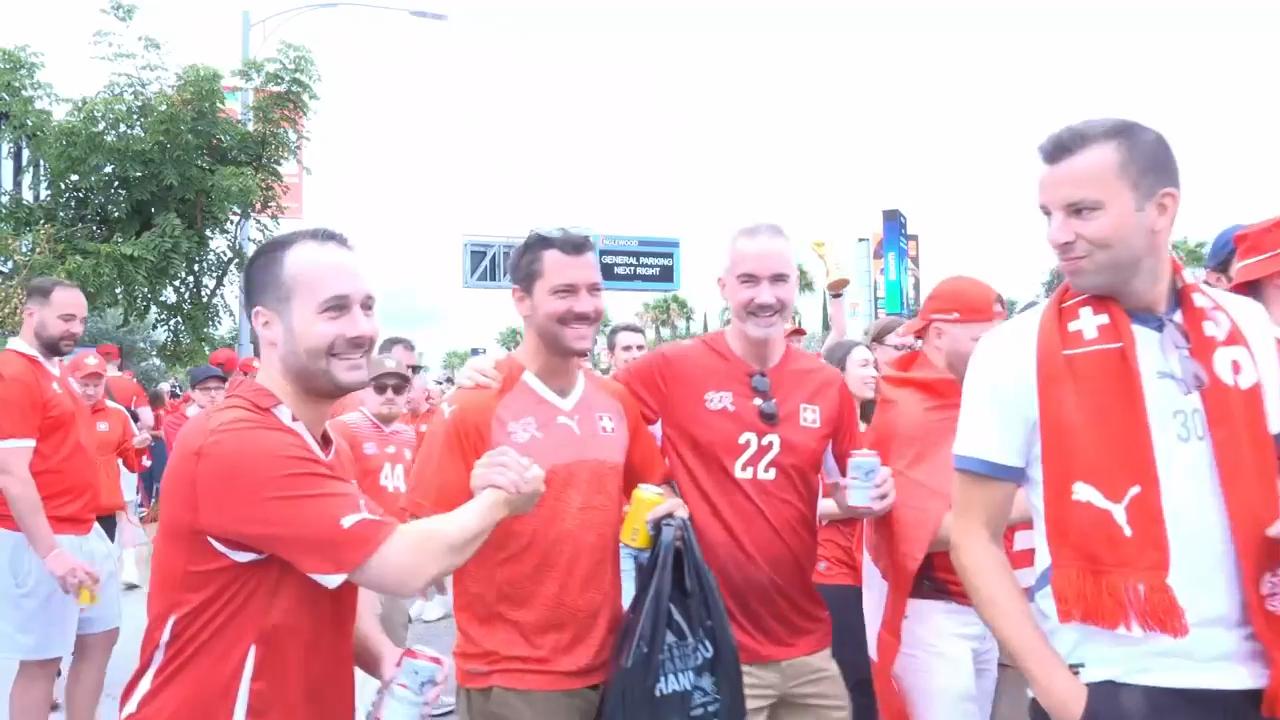 Swiss and Bosnian fans cheer and march to Los Angeles stadium for World ...