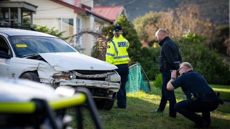 Woman struck man with car 'at speed' in Hobart frontyard, police say