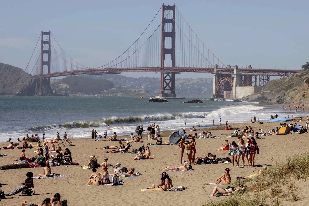 Woman, child in critical condition after sneaker wave sweeps them off ...