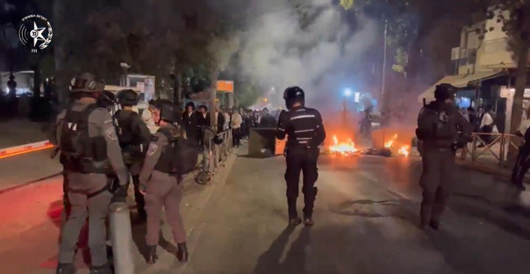 Ultra-Orthodox protesters block traffic, set fire on road near ...