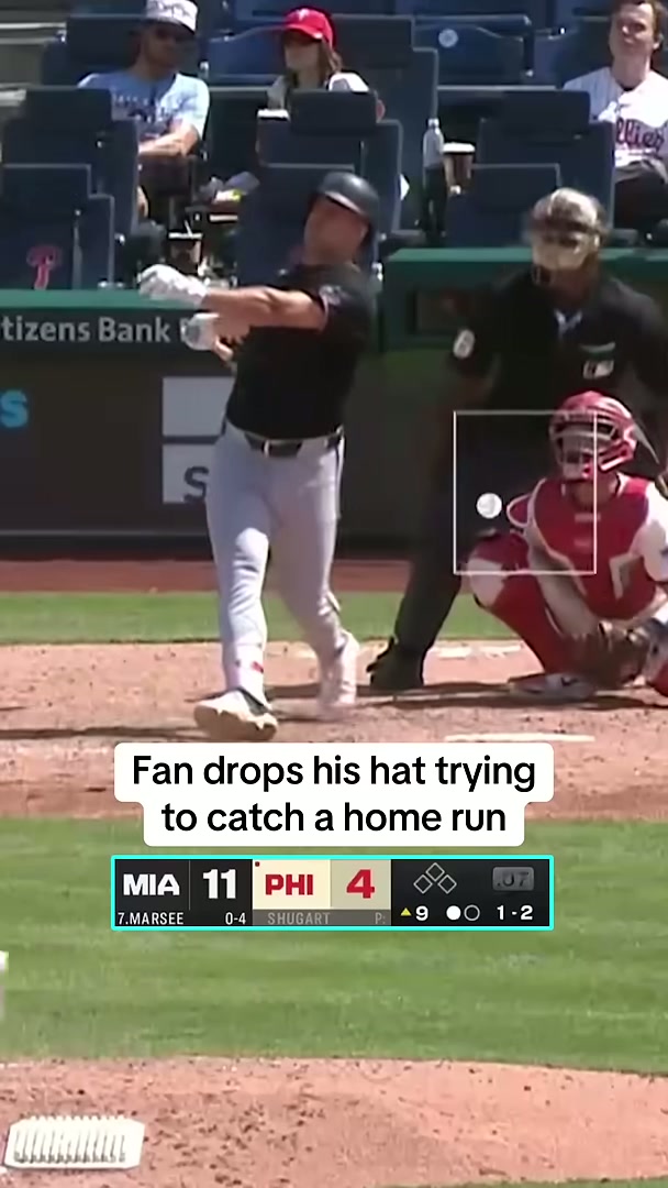 Phillies fan drops his hat over the railing on a home run