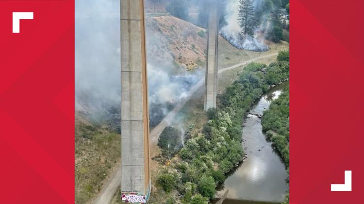 Spokane police detain two people following hillside fire threatening ...