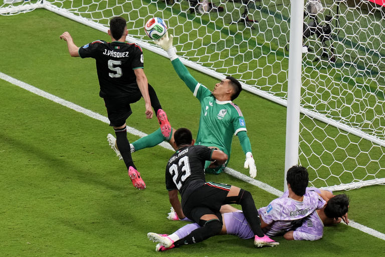 Mexico becomes first country to reach knockout stage of World Cup ...