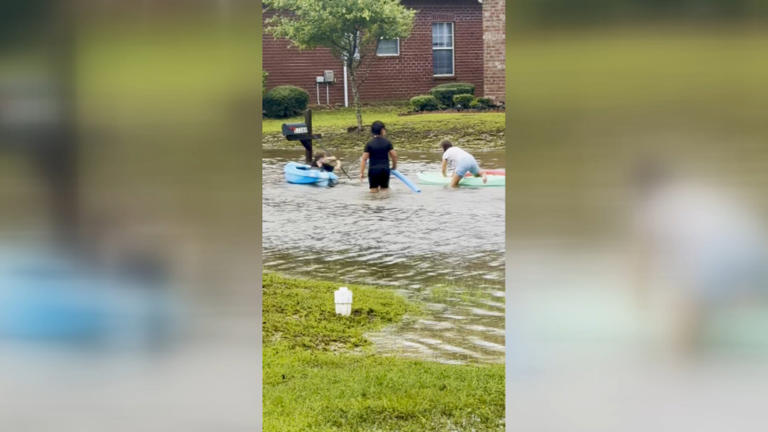 Flooded roadways trapped residents inside Timber Creek Estates in Biloxi