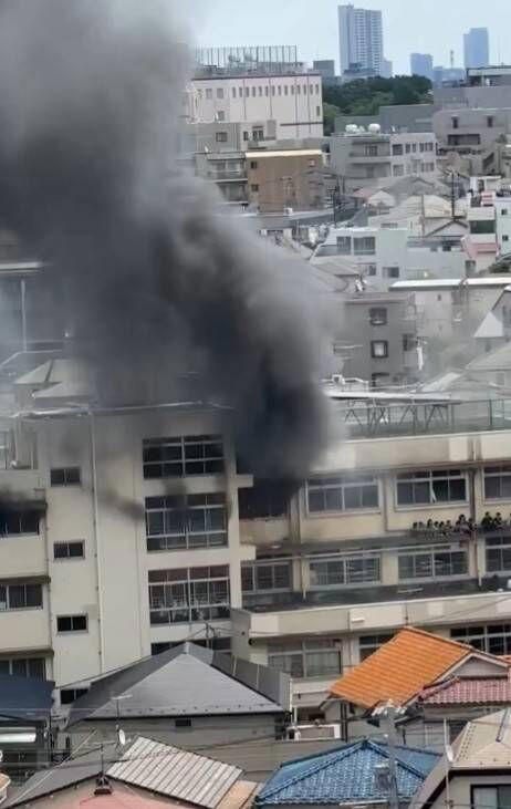 Tokyo school fire: Children cling to window ledge as blaze engulfs ...