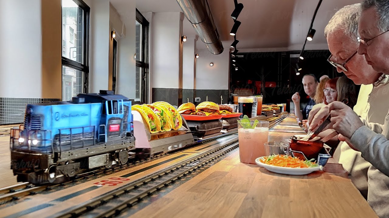 Inside bizarre restaurant delivering burgers by trains directly to ...