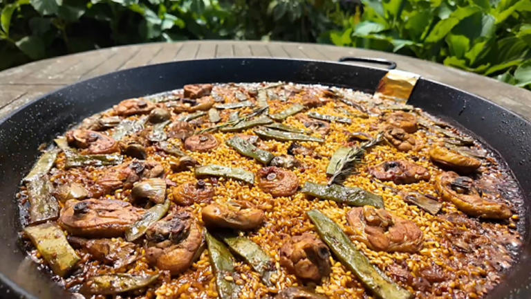 Traditional Spanish paella technique explained through a step by step ...