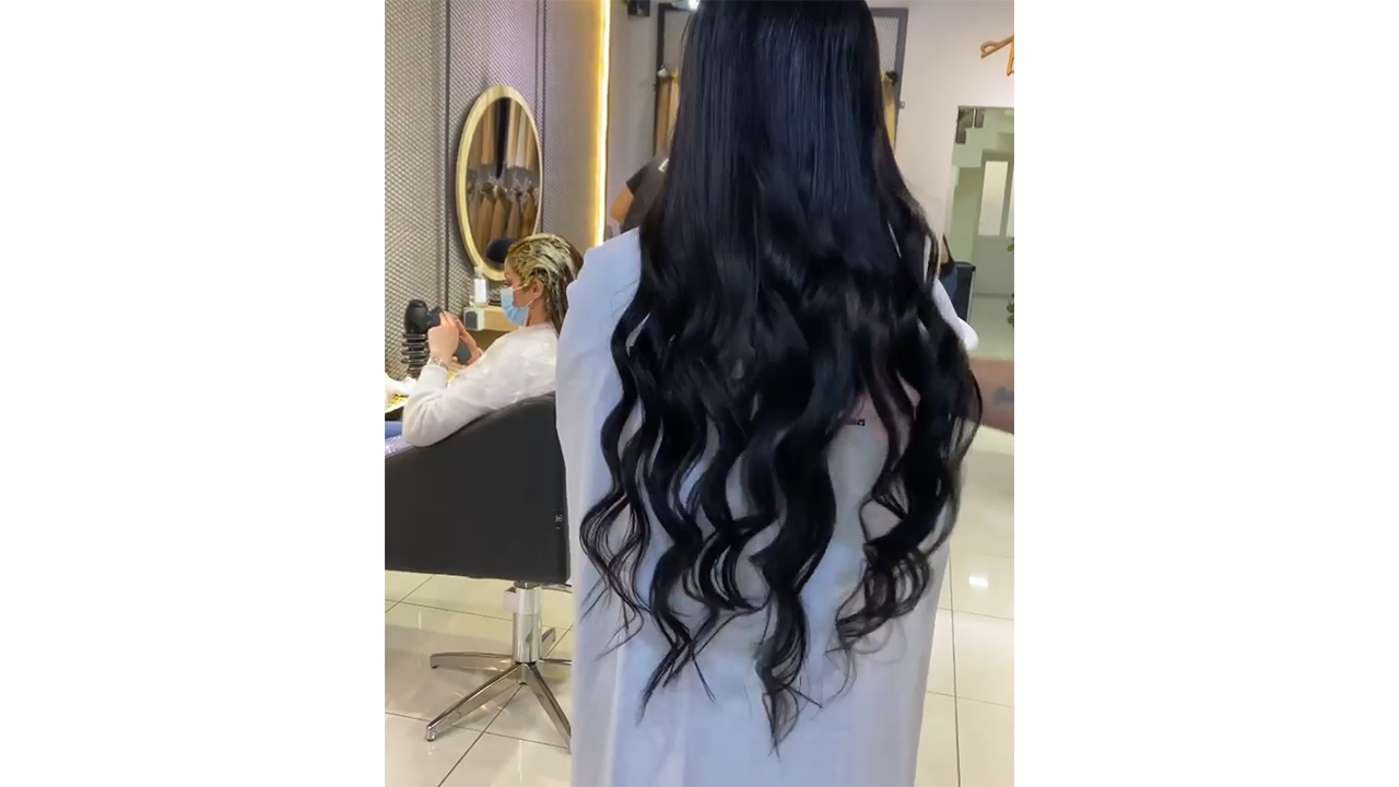 Creating midnight black mermaid waves with defined curl styling ...