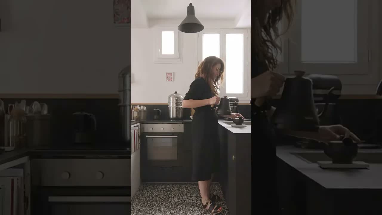 Matte black resin kitchen in small Paris apartment