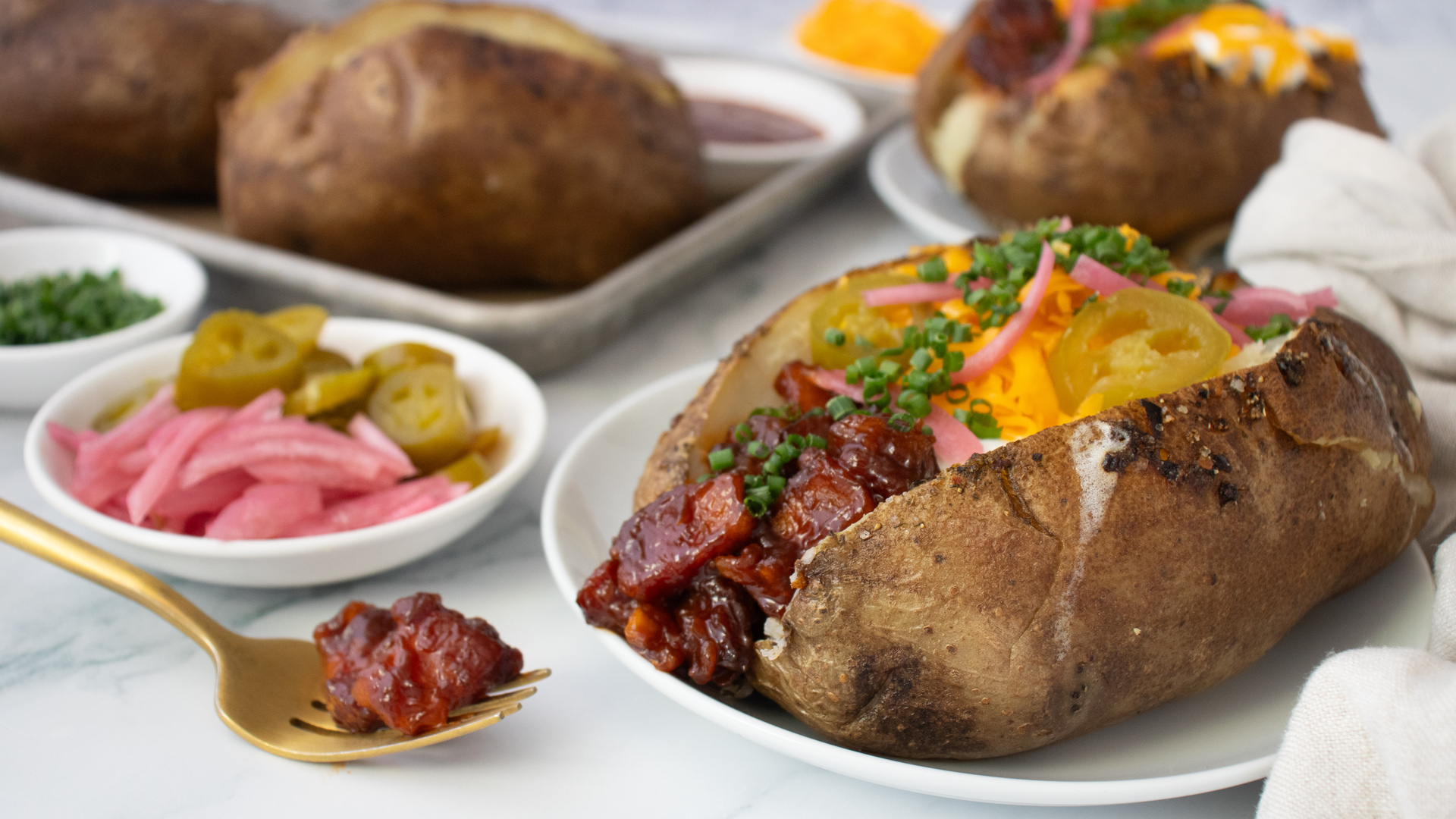 Loaded BBQ pork belly baked potatoes recipe