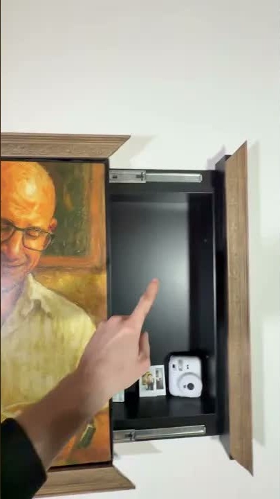 Secret safe hidden in dad's cafe painting!