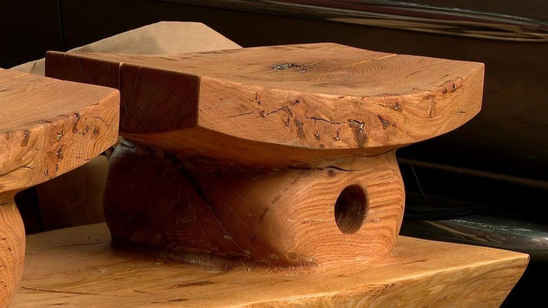 Oak tree downed by Helene gets new life as public art bench at YMI ...
