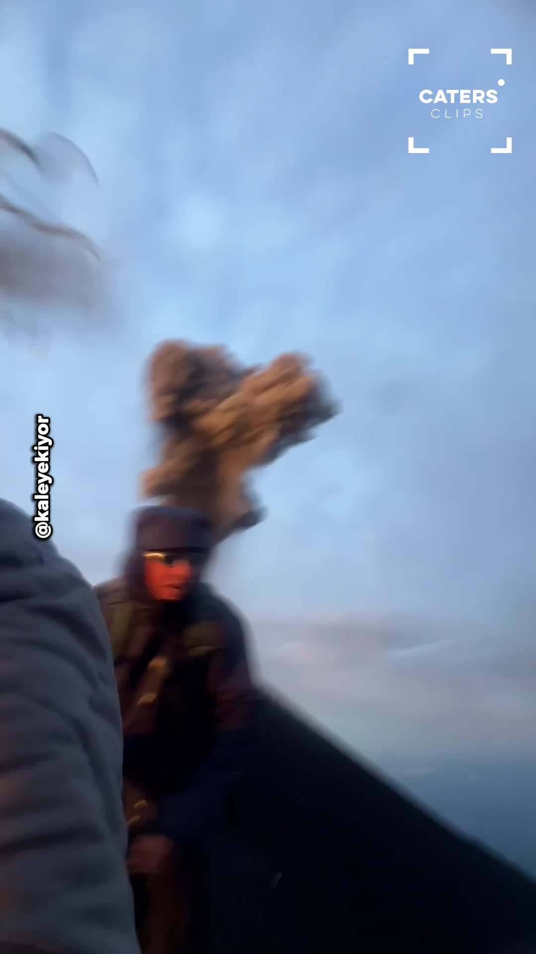 Tourists sprint from falling rocks as volcano erupts