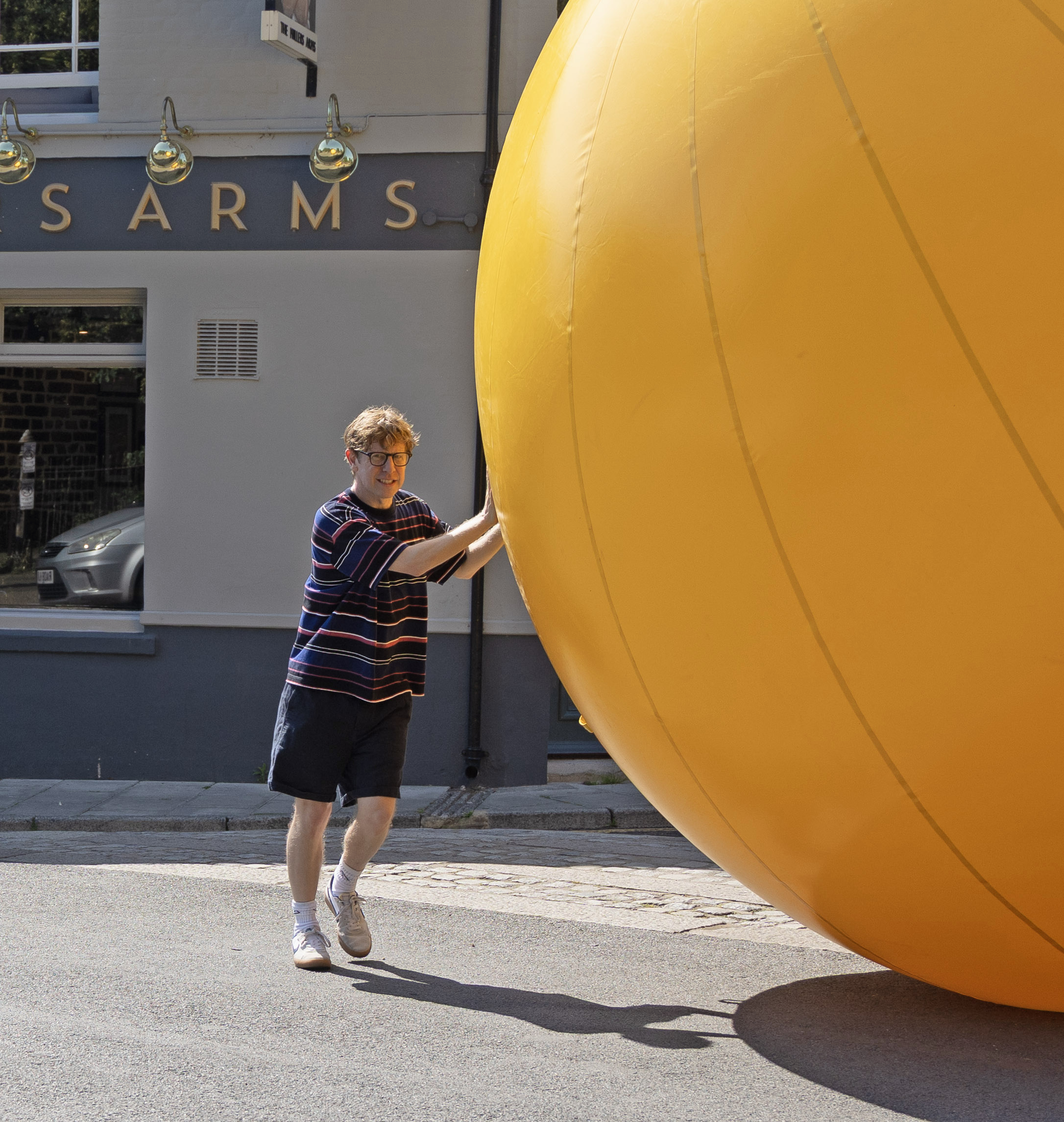 Josh Widdicombe wrangles giant yellow ball on to boat for new TV show
