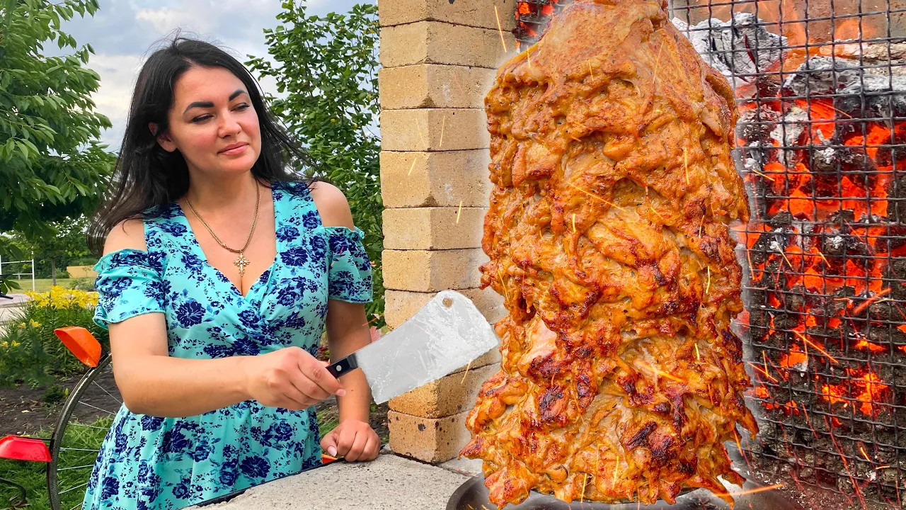 Huge, juicy chicken shawarma cooked on a vertical rotisserie