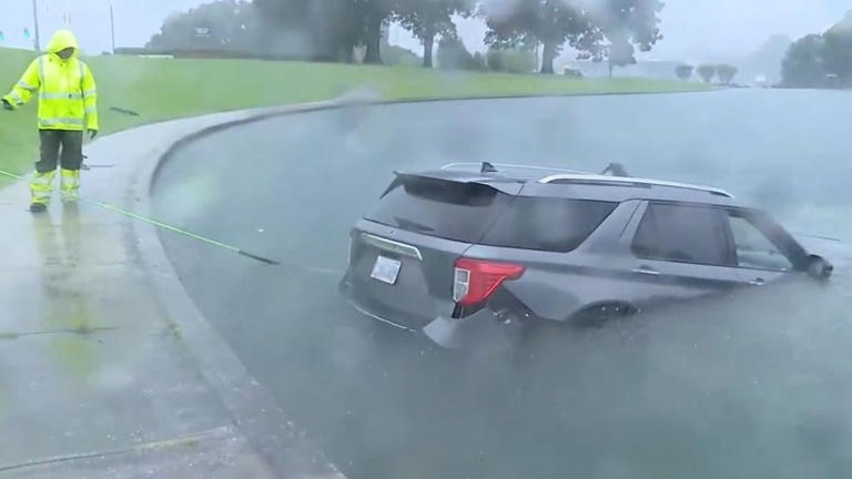 Driver rescued after vehicle plunges into pond at Meadowbrook Corporate ...