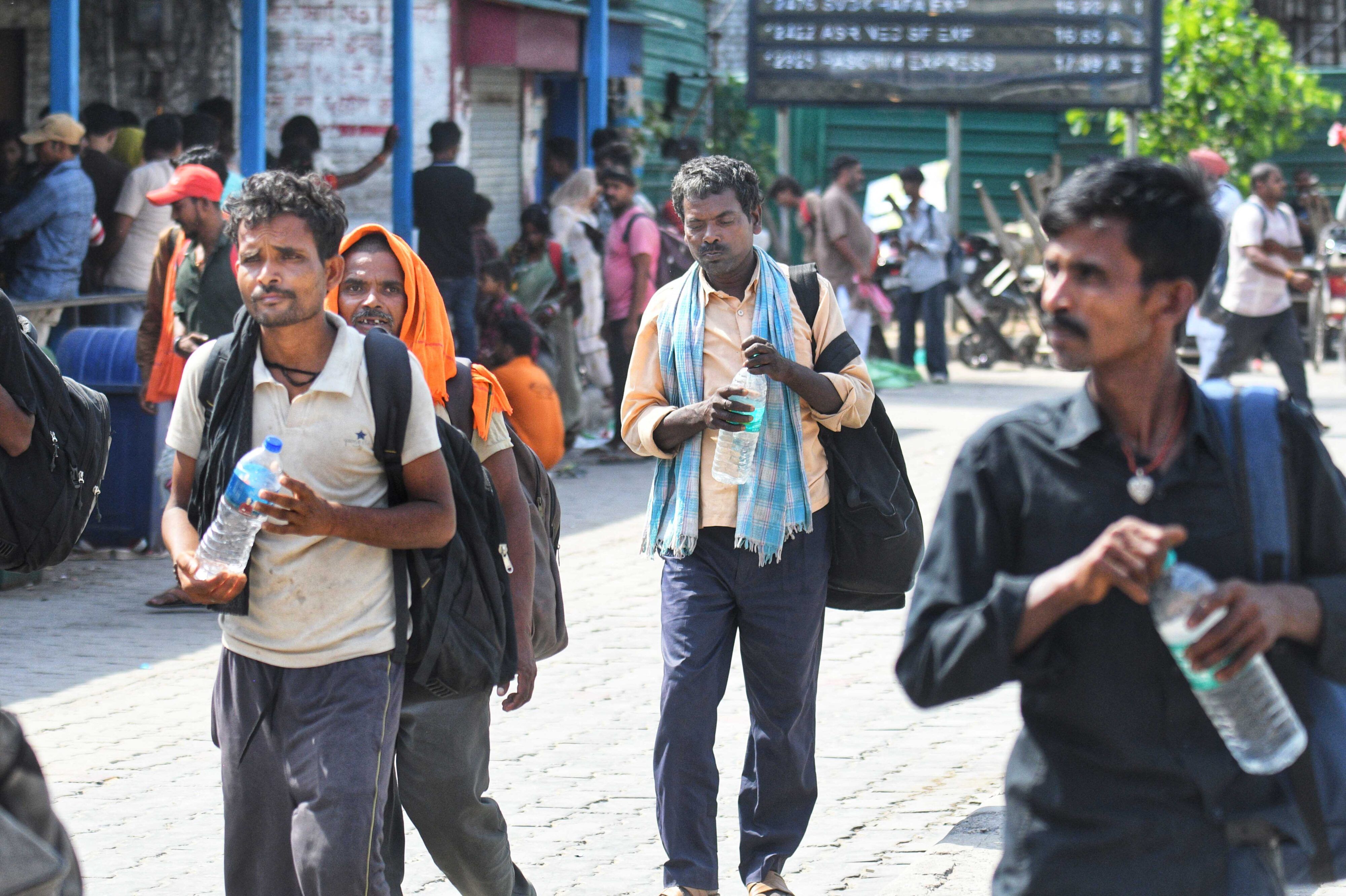 In pictures: Bihar migrants brave heat and humidity to keep Punjab's ...