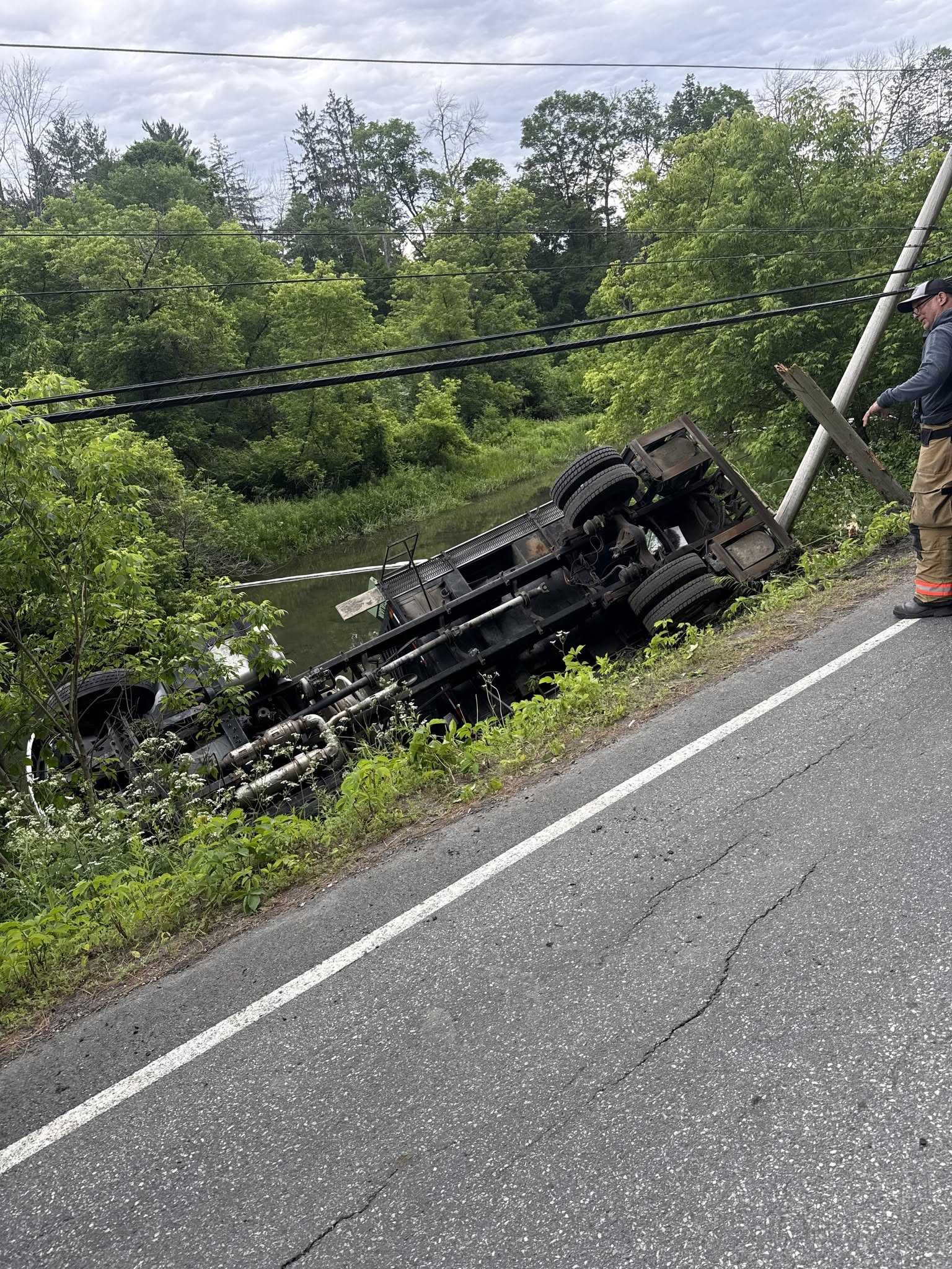 Truck rolls down embankment, leaks fuel into river in Vermont