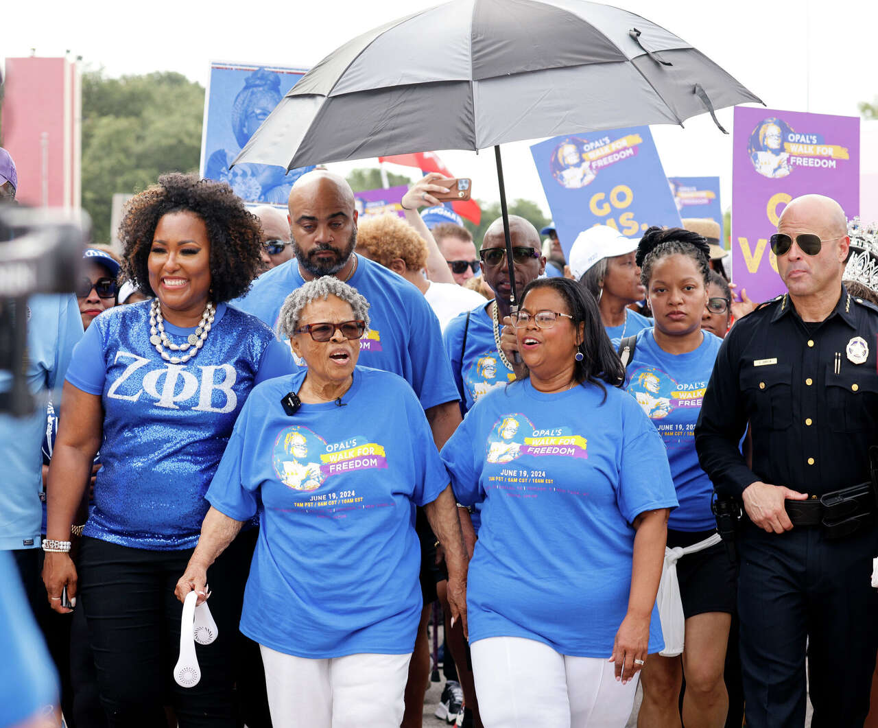 Storms stall but don't stop hundreds who walk in Opal Lee's Walk of ...