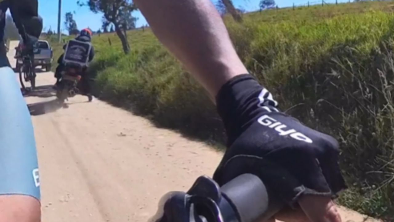 Bike rider moves sideways on road and ends up falling down