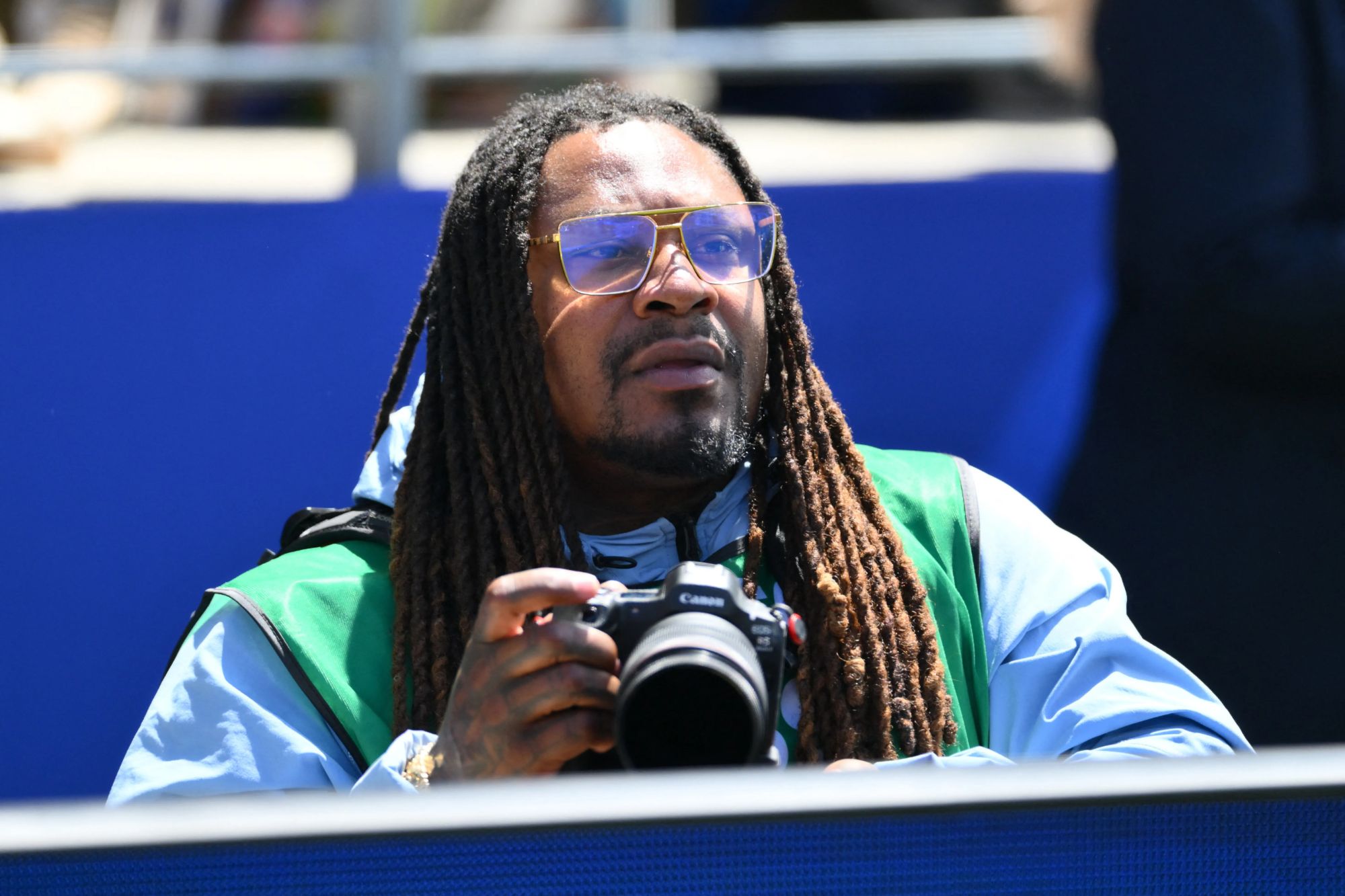 Marshawn Lynch works as photographer for USA vs Australia match