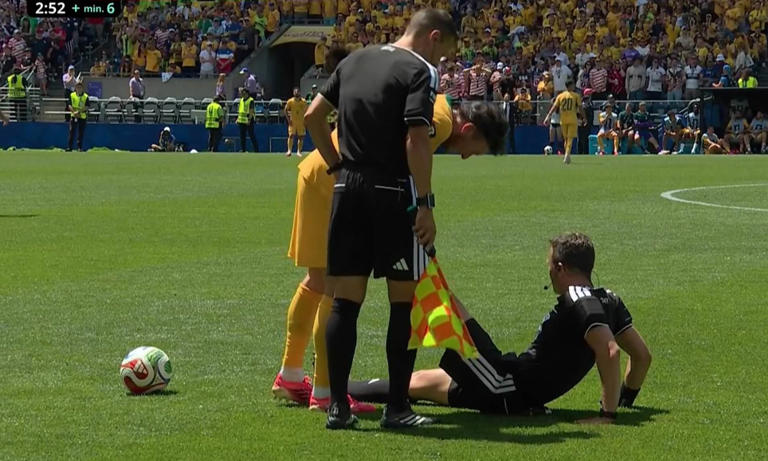 Humiliating moment World Cup referee goes down with injury delaying USA ...