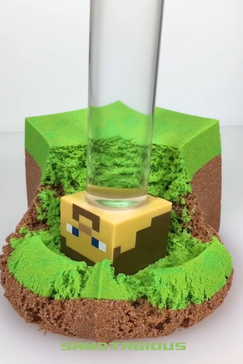 Minecraft style sand art sculpture in glass base