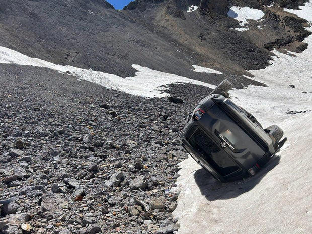 Driver rolls down Colorado mountain pass after sliding off icy road