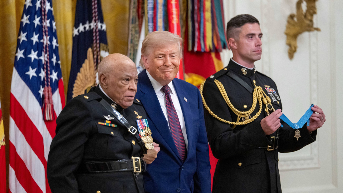 Donald Trump struggles to put medal on veteran as health rumors swirl