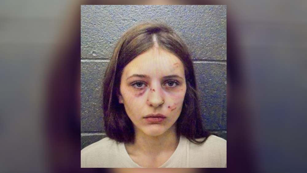 Woman accused of breaking into area house, fighting people inside