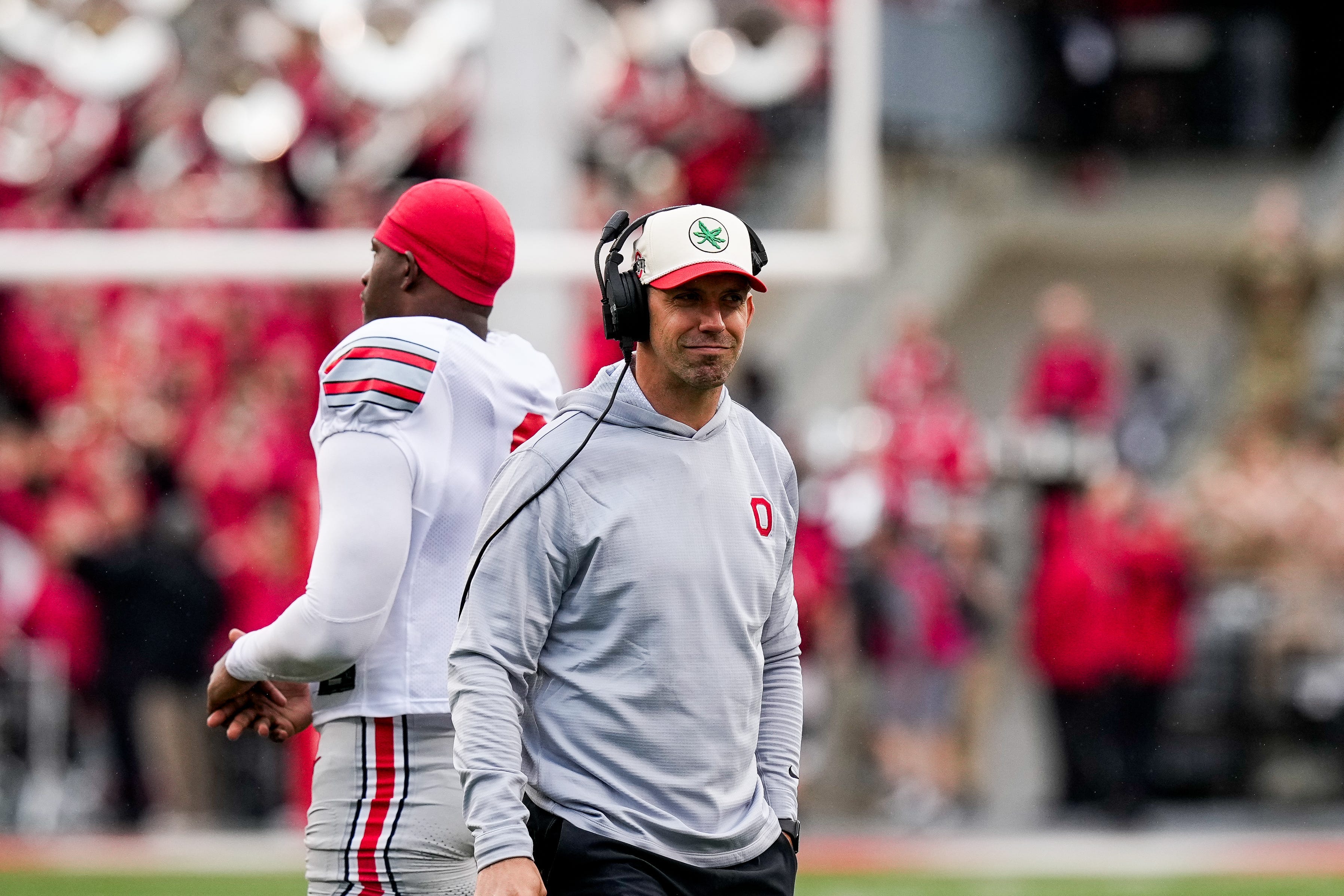 Ohio State assistant James Laurinaitis gives staff June Olympics win