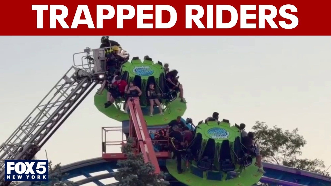 Firefighters working to save trapped riders at Adventureland