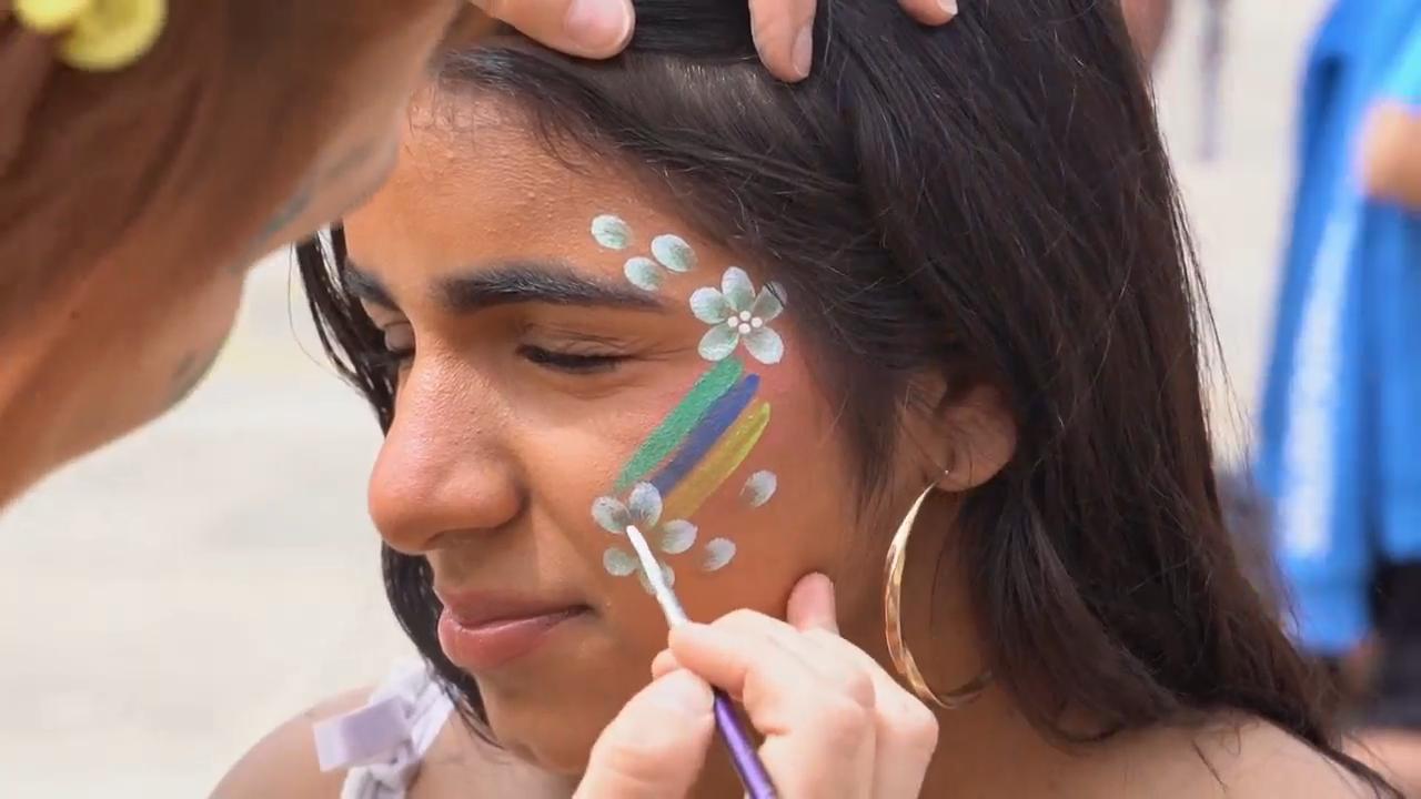 Face-painting artist helps World Cup fans show national pride