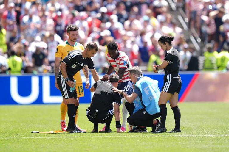 USMNT and Australia players step up as World Cup referee goes down in pain