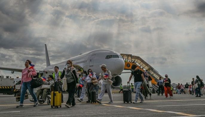 Happy but homesick, OFWs wait for a better Philippines before returning