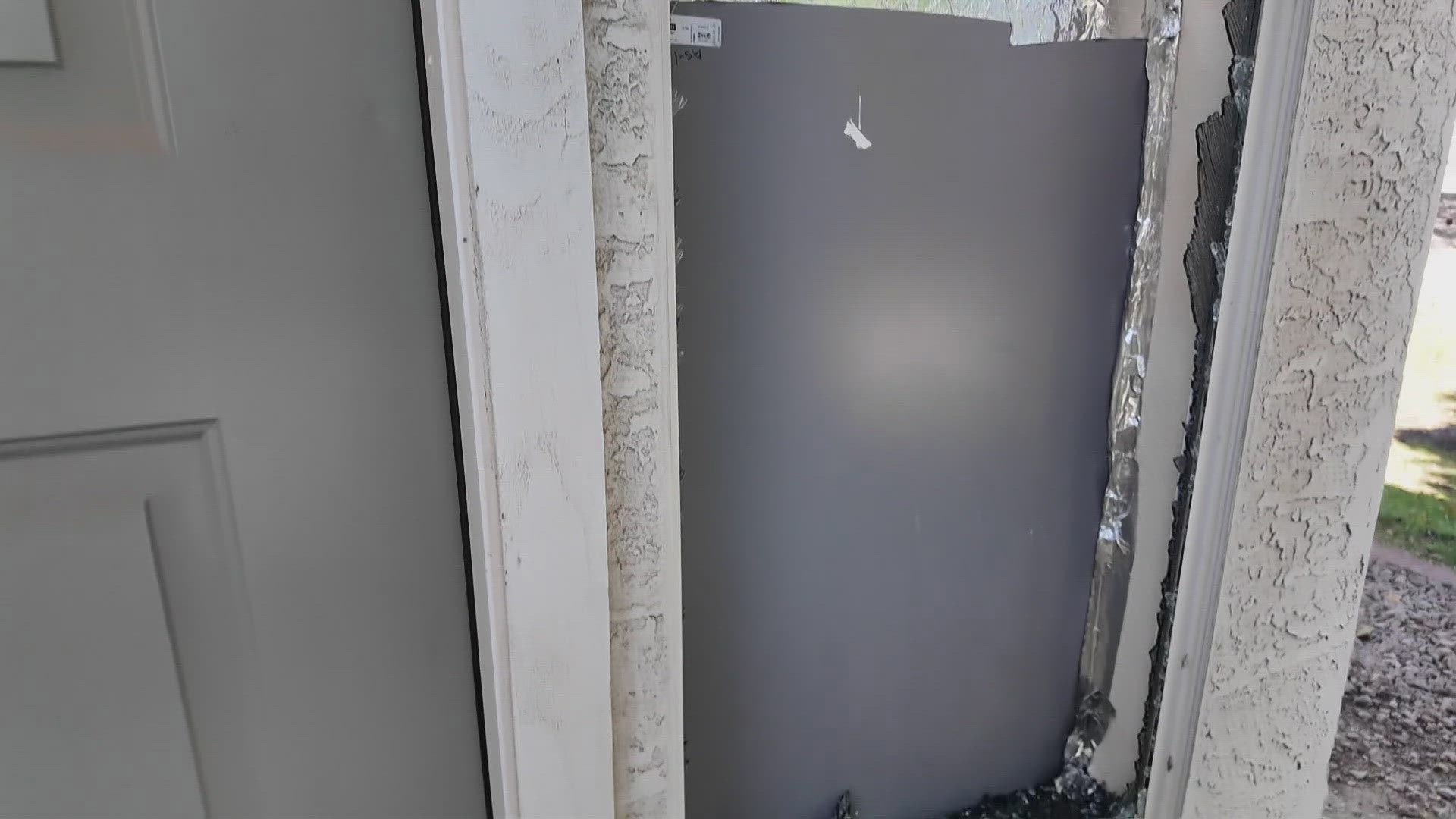 Man caught on camera throwing a brick through a home's window