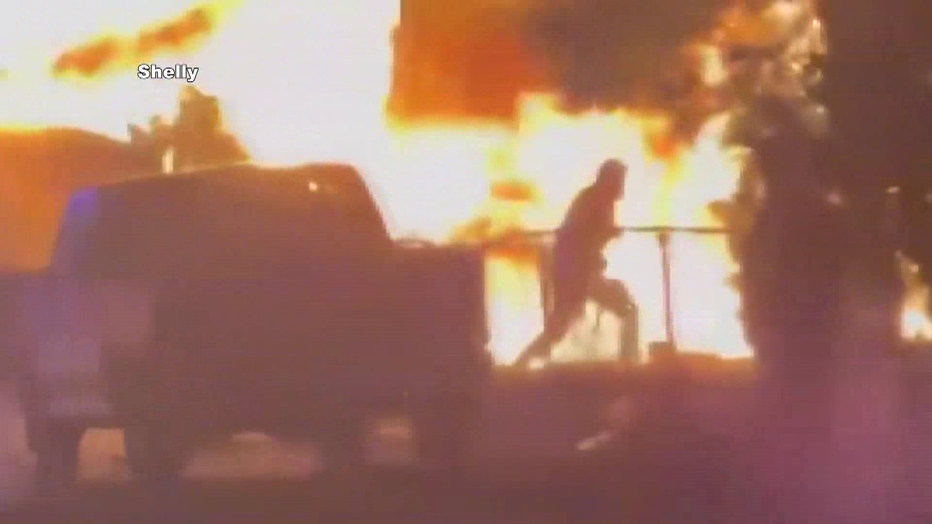 New video shows man running into burning Mesa home to save wife