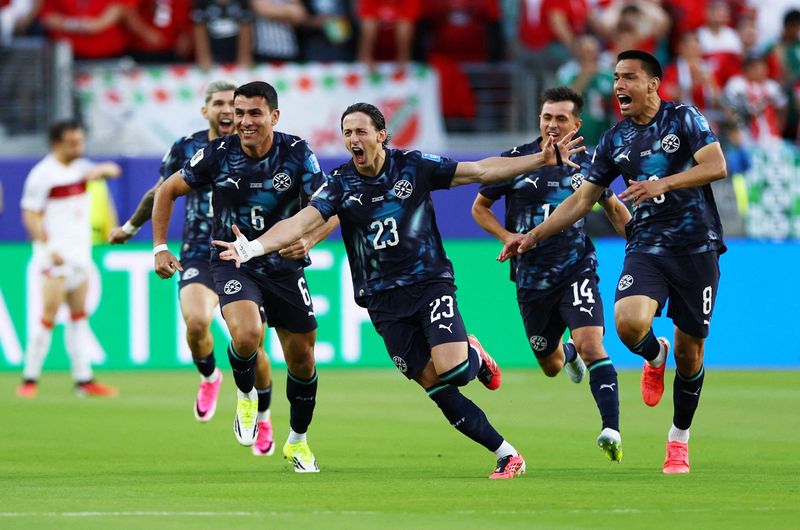 Soccer-ten-man Paraguay eliminate Turkey with never-say-die 1-0 win