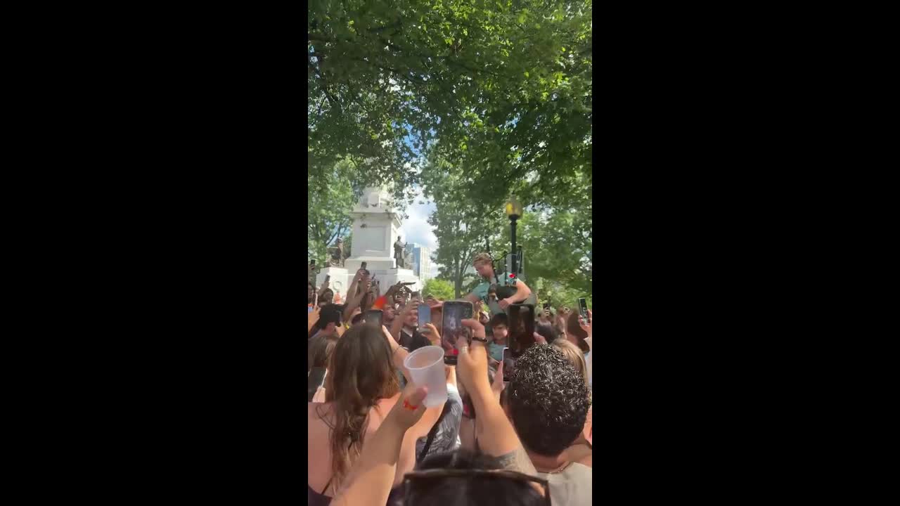 Scottish piper hoists lobster above fans at World Cup gathering in Boston