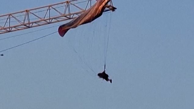 Paraglider left dangling after getting caught in tower crane in Sichuan