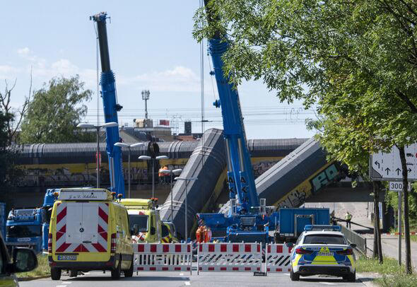 Munich train crash horror as carriages derail and plunge off bridge